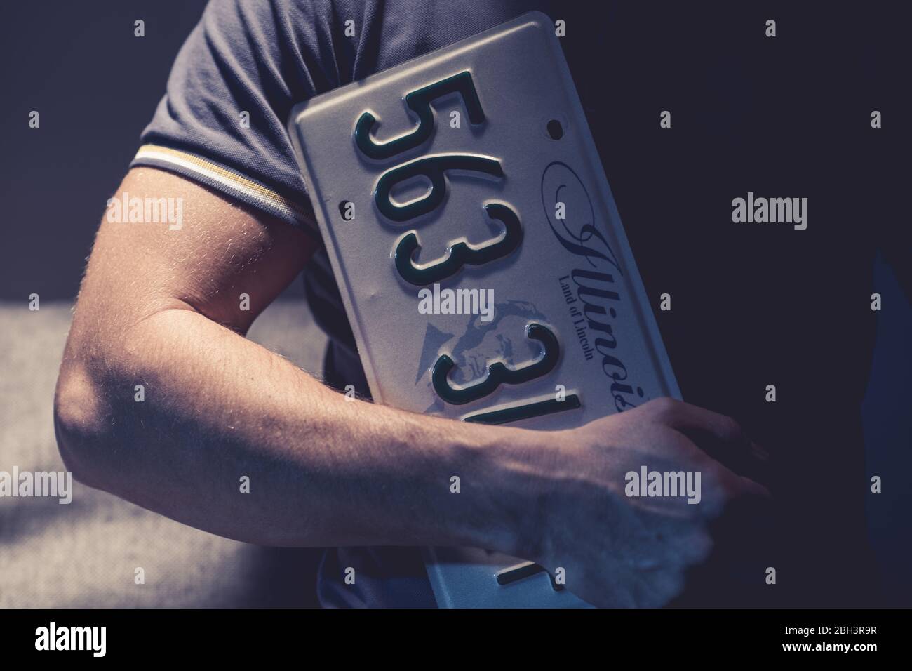 Caucasian Male Holding License Plate From Car In Illinois Stock Photo ...