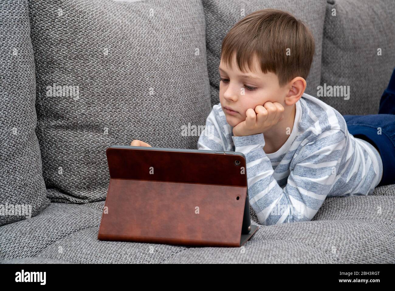 Sad kid computer hi-res stock photography and images - Alamy