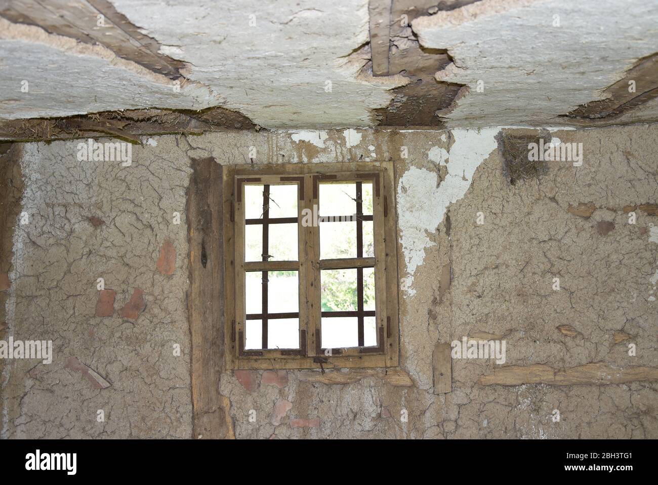 Ancient metal window on old collapsed house Stock Photo - Alamy