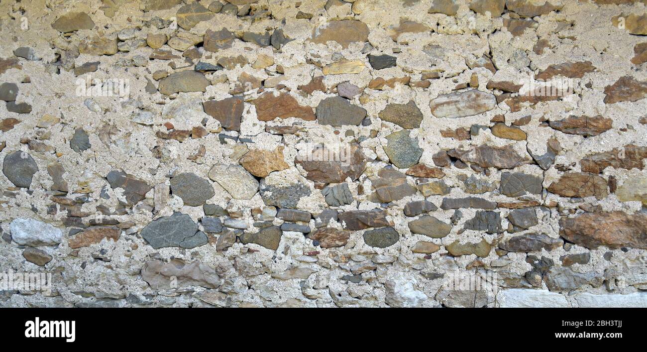 Ancient stone wall texture on old house Stock Photo - Alamy
