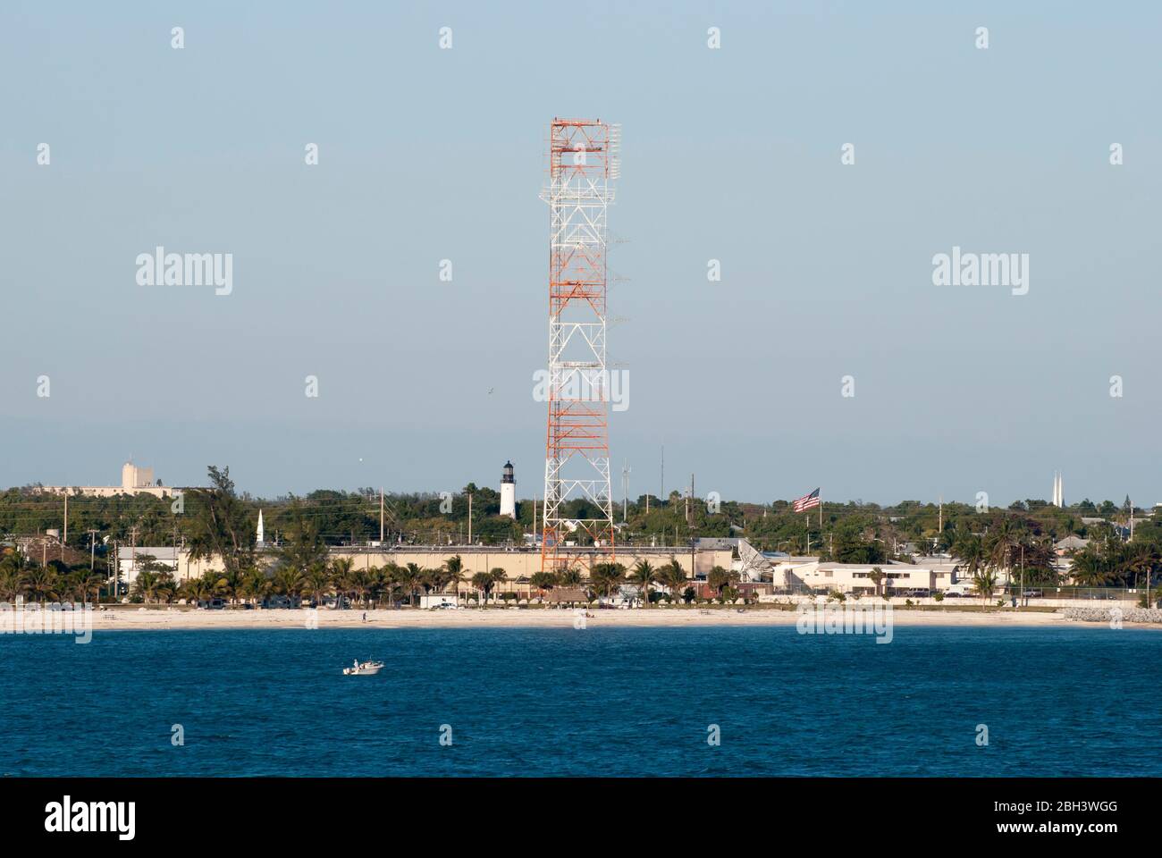 The view of Key West historic lighthouse and telecommunication tower on ...