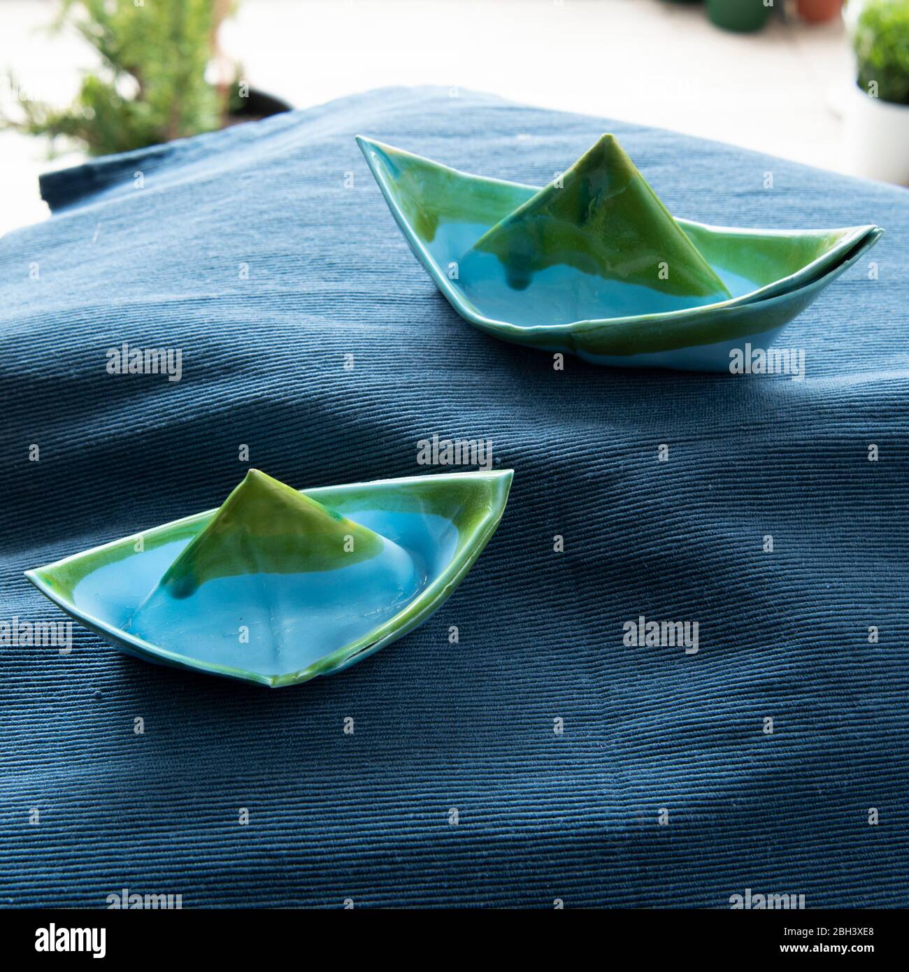 colorful ceramic ships, paper origami handcraft Stock Photo - Alamy