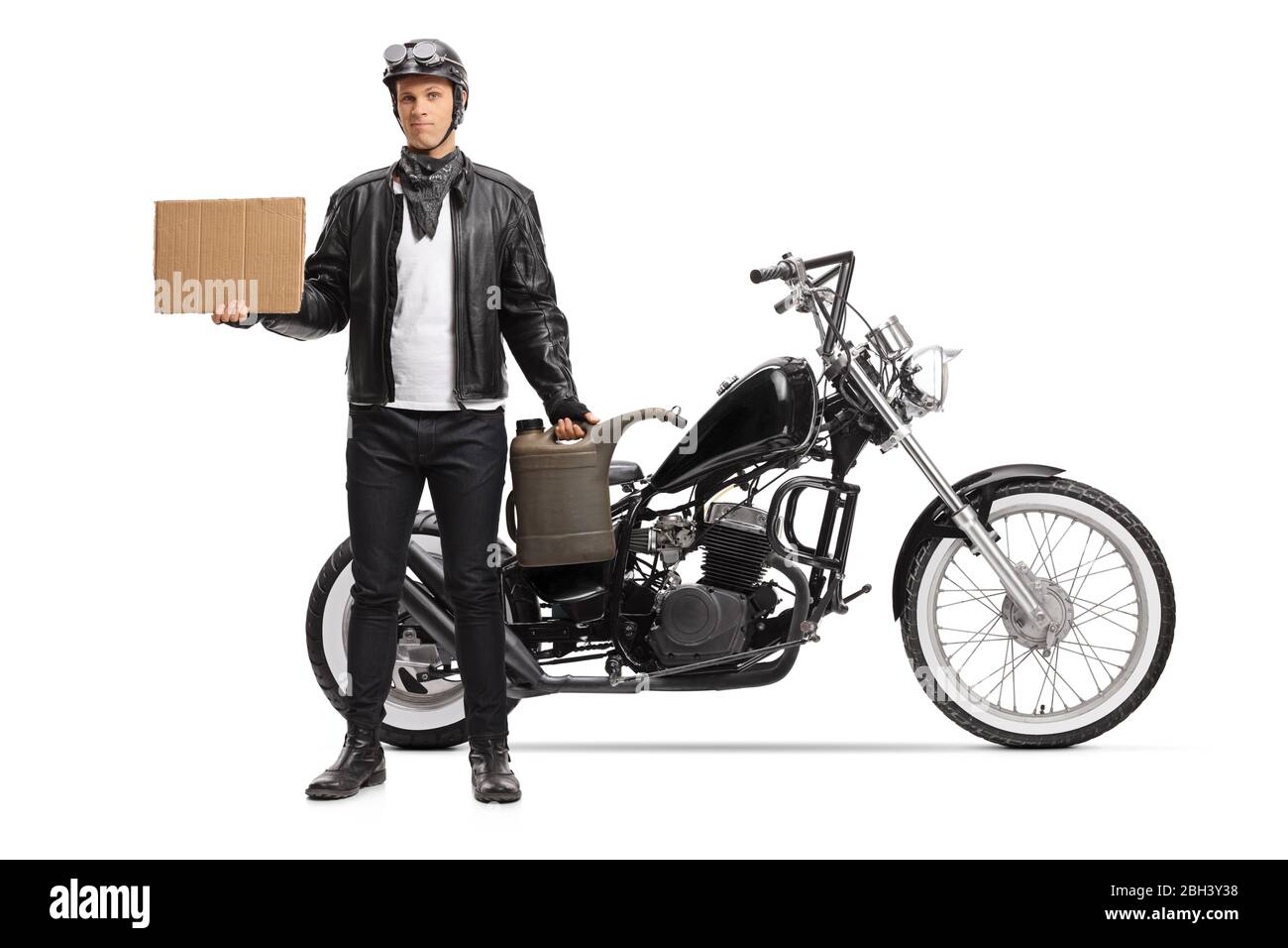 Young biker holding a gas container and a blank cardboard sign and ...