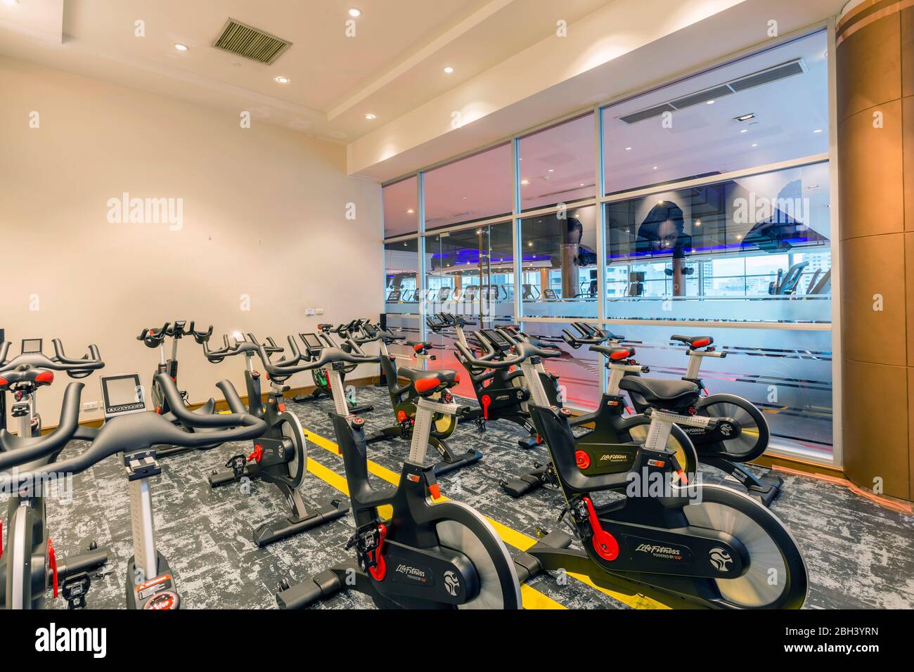 Spin cycle class room at the Cascade Club in Bangkok, Thailand Stock ...