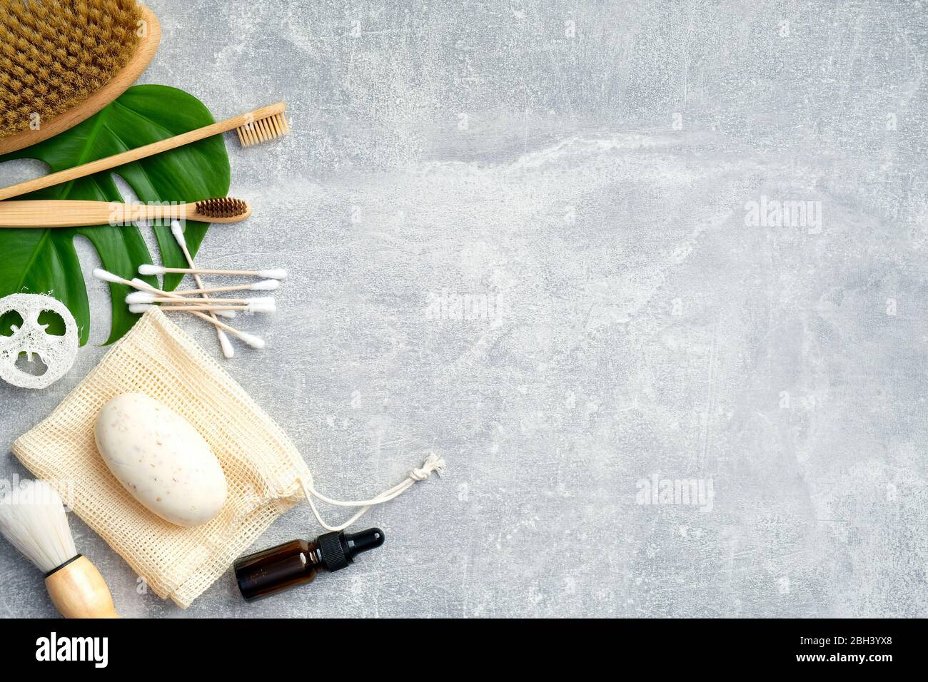 Eco-friendly personal hygiene products and bath accessories on stone ...