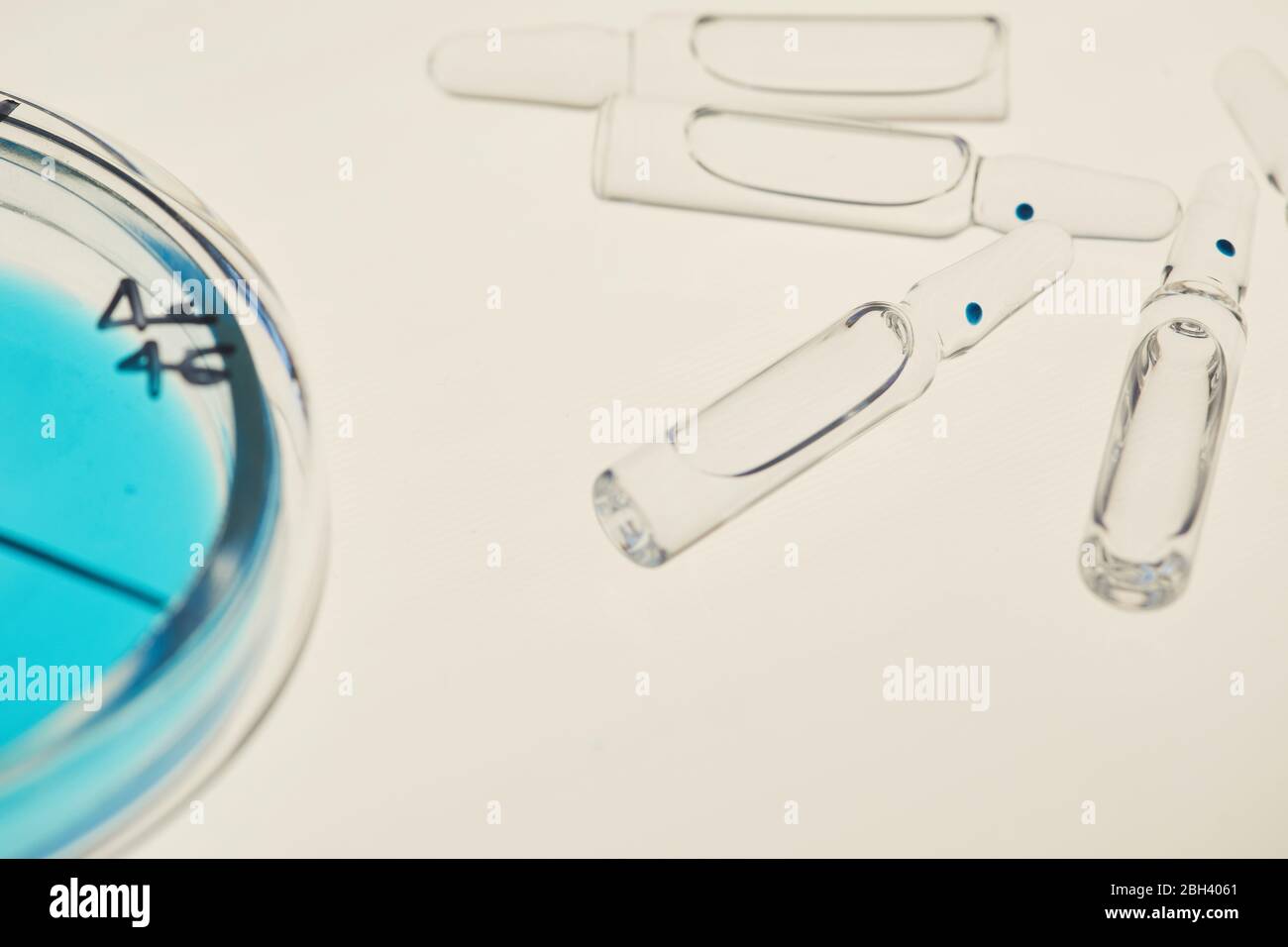 Close-up of glass capsules with liquid inside for treating from disease ...