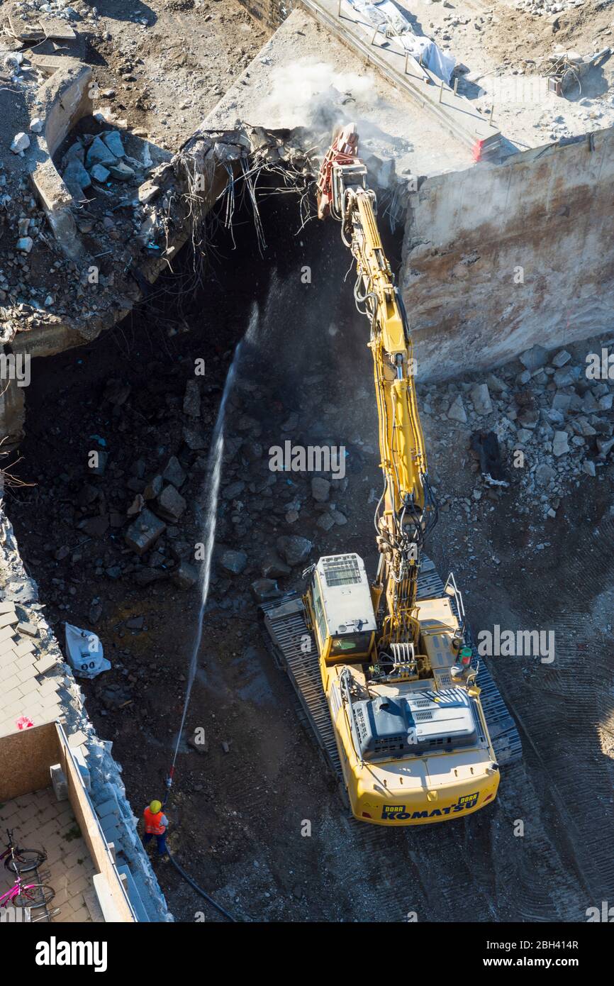 Wien, Vienna: excavator with demolition pliers demolishing a building ...