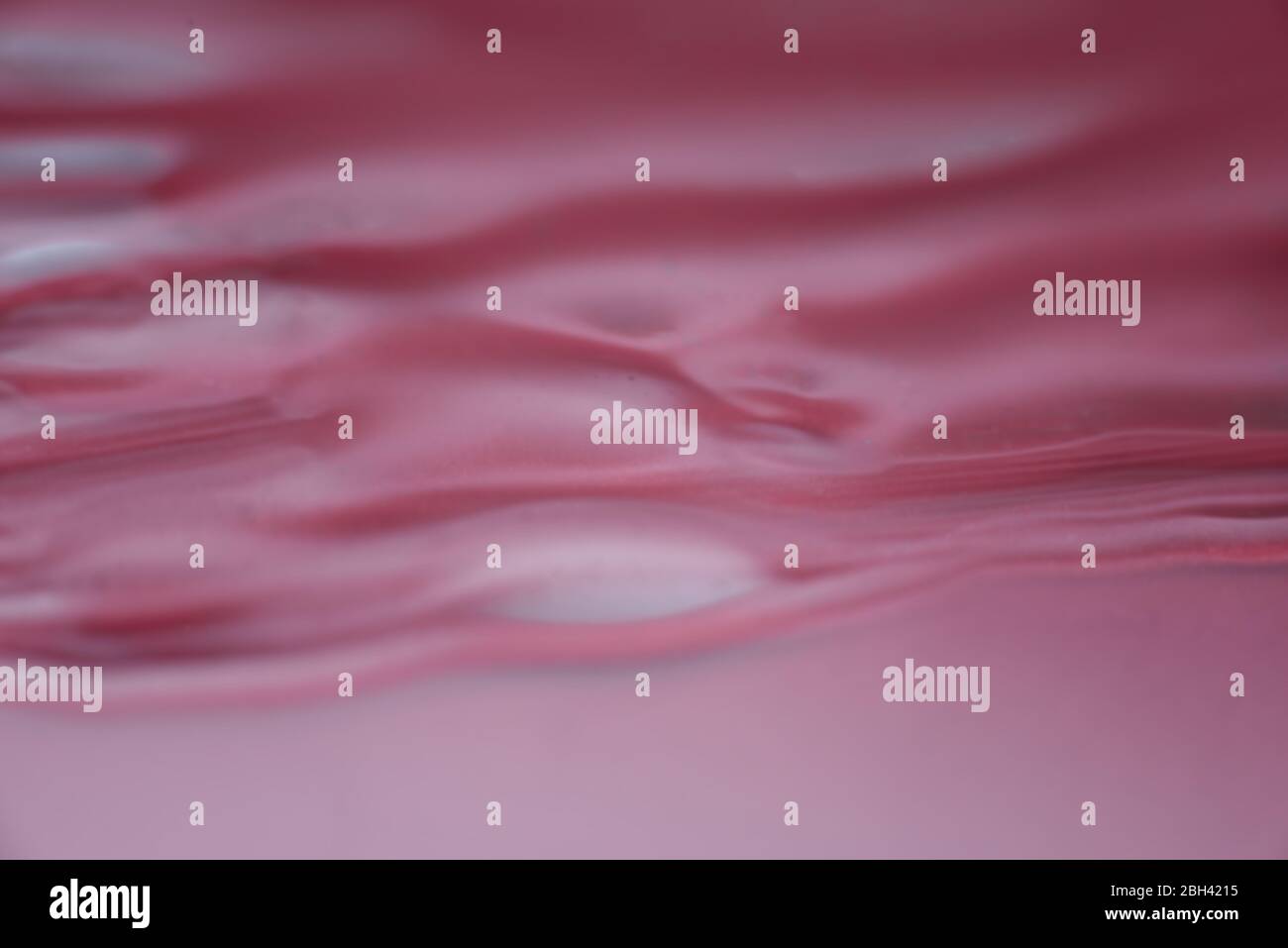 Abstract texture. Liquid gel cosmetics with little bubbles. Red ...