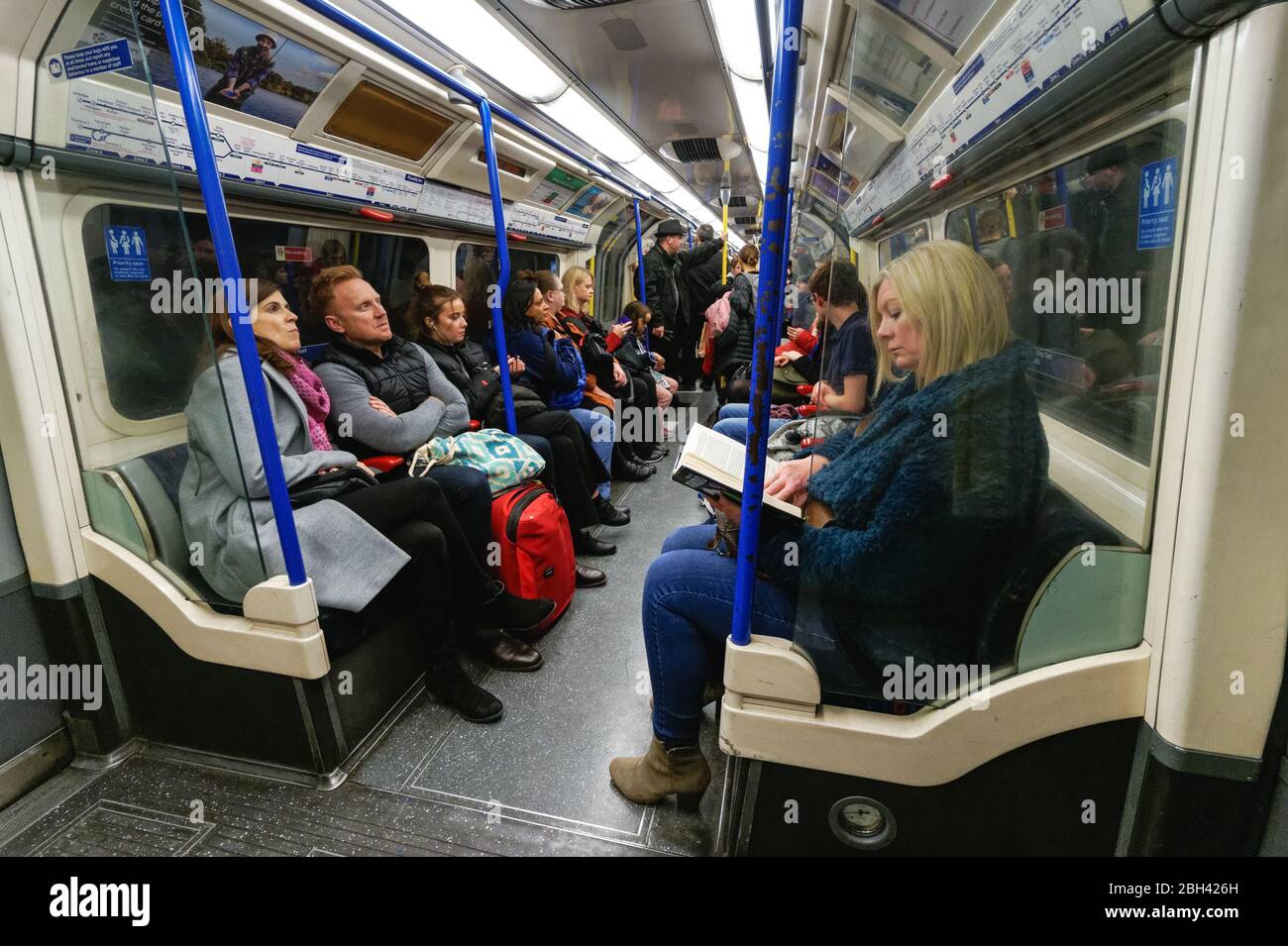Passengers inside Piccadilly line underground carriage,London England ...