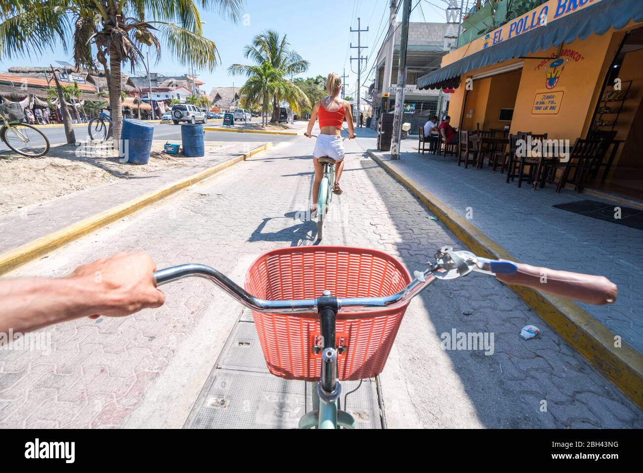 First Person View riding Bike with Woman in Mexico Stock Photo - Alamy