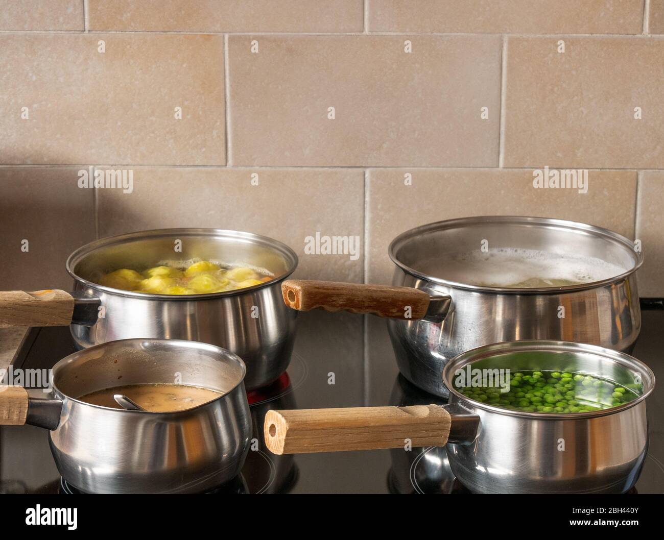 Pots of food on stove hi-res stock photography and images - Alamy