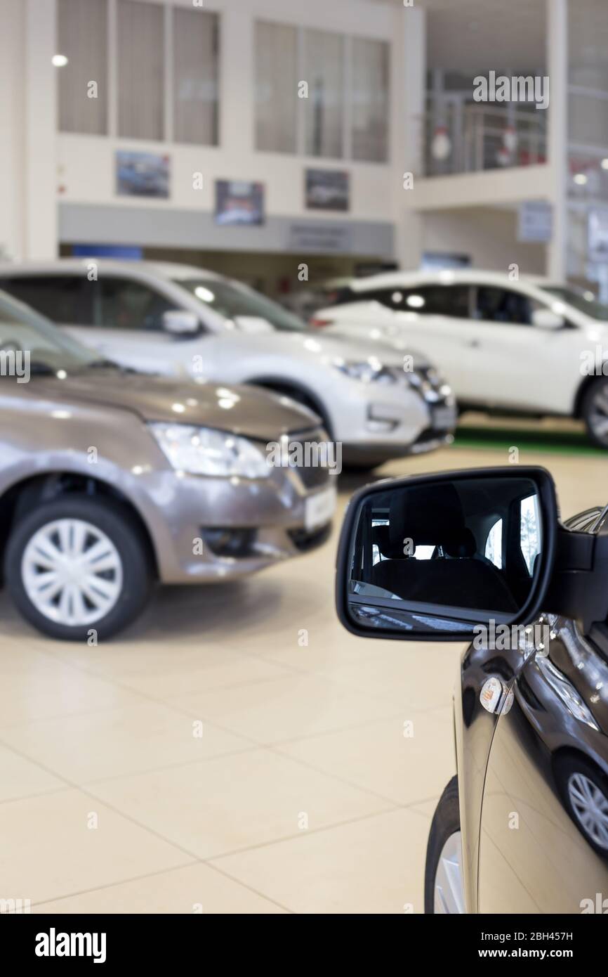 New cars at dealer showroom. Themed blur background with bokeh effect ...