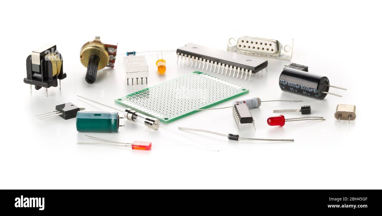Different electronic parts or components on white background with ...