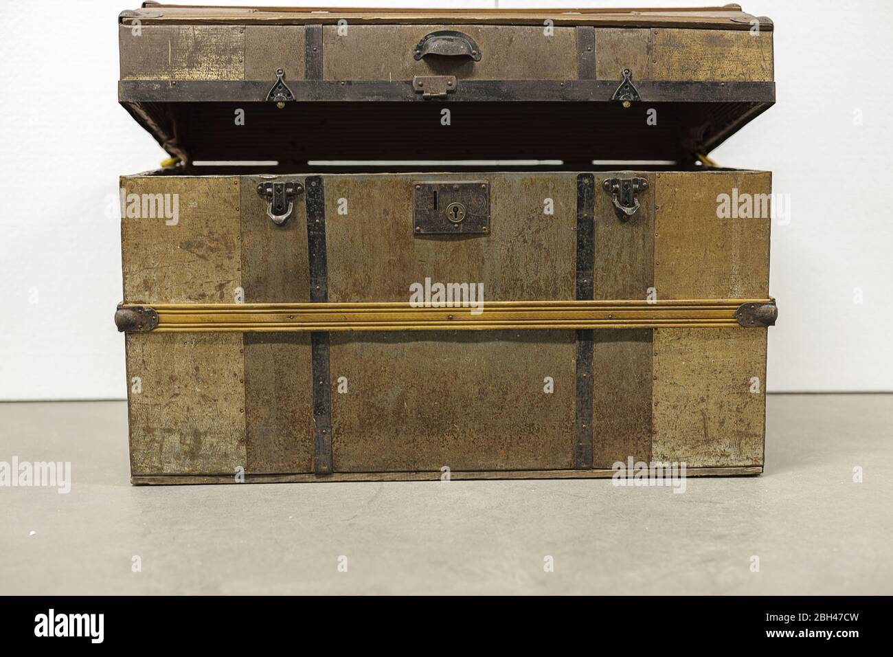 Close up view of an opened antique chest isolated on white background ...