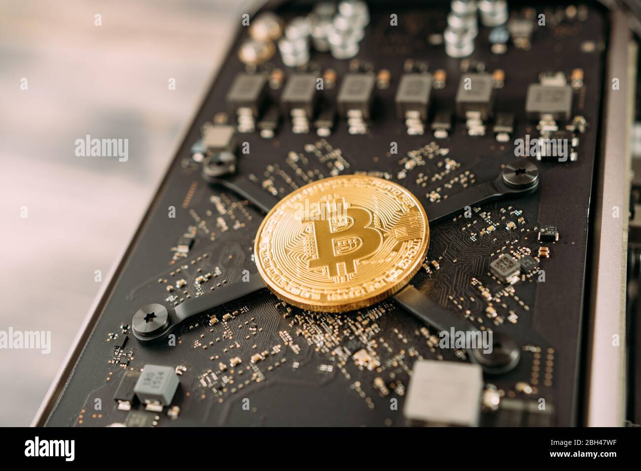 Bitcoin gold coin lies on the motherboard of the computer Stock Photo ...
