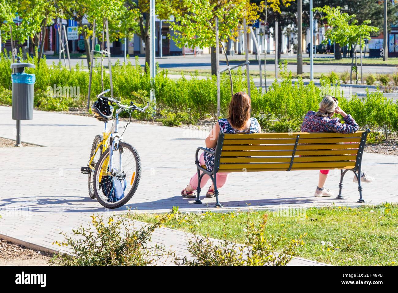 Female sitting on bike hi-res stock photography and images - Alamy