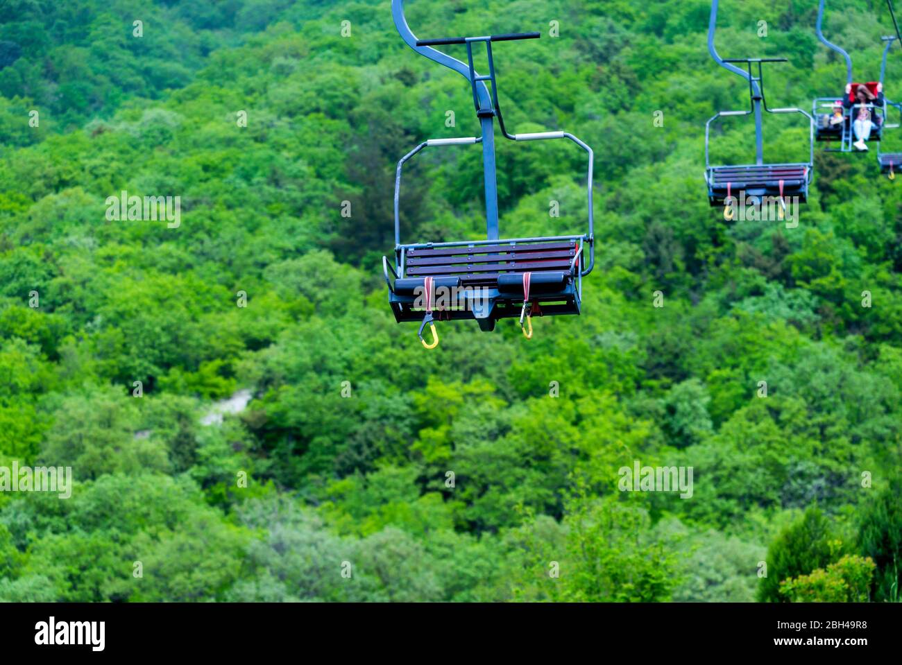 Funicular with seats in the mountains resort Stock Photo - Alamy