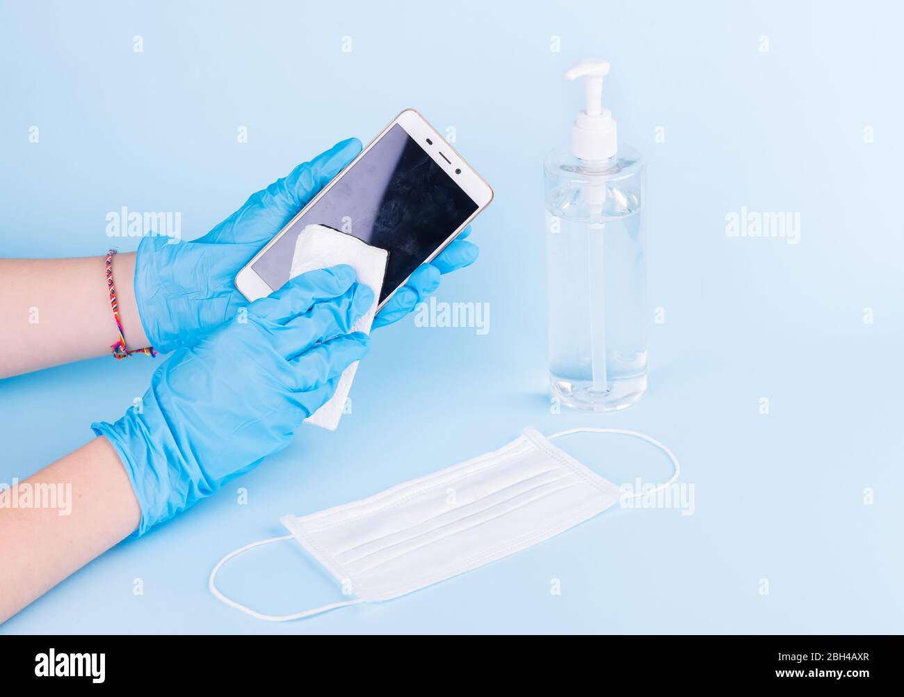 Cleaning mobile phone to eliminate germs, cleaning the cell by hand ...