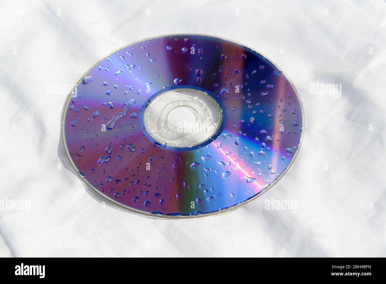 Wet CD disc. Wet DVD disc. Raindrops on disc Stock Photo - Alamy