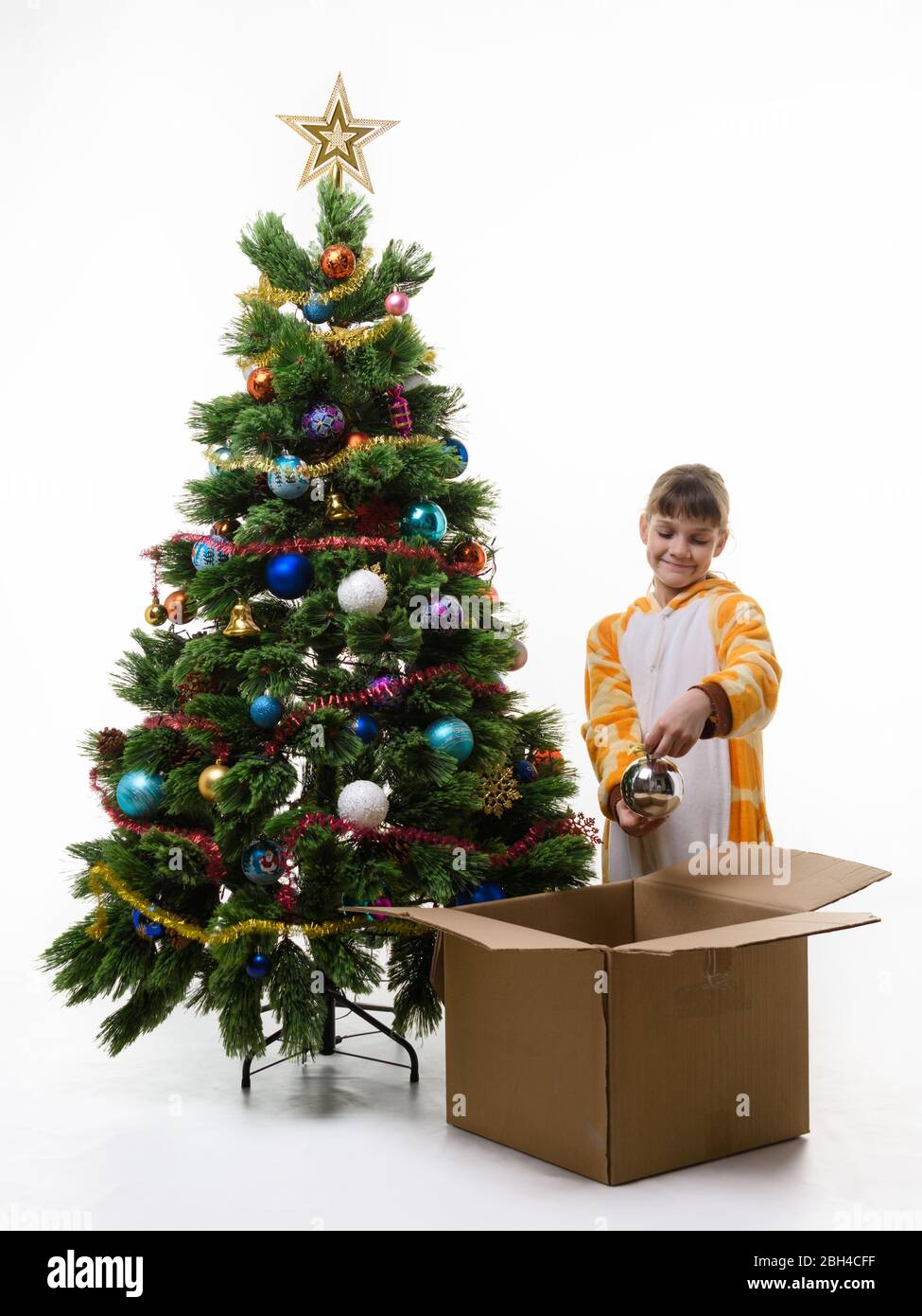 Girl pulling christmas tree hi-res stock photography and images - Alamy
