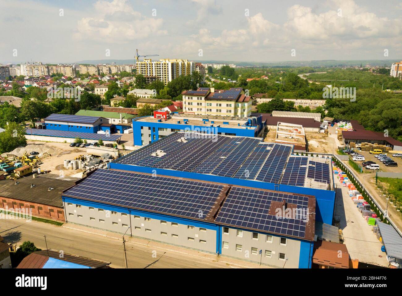 Aerial view of many photo voltaic solar panels mounted of industrial ...