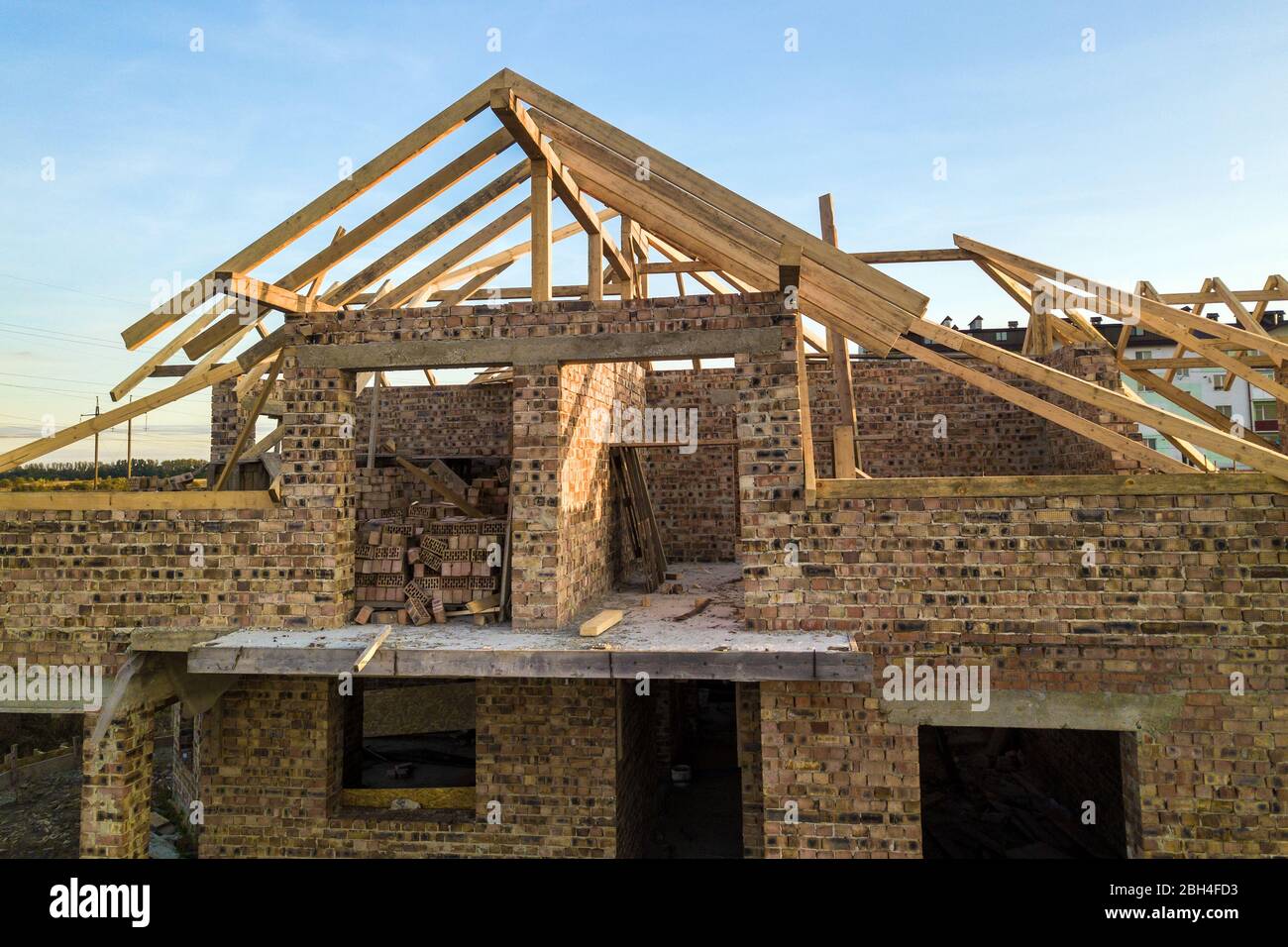 Private residential house with wooden roof frame structure under ...