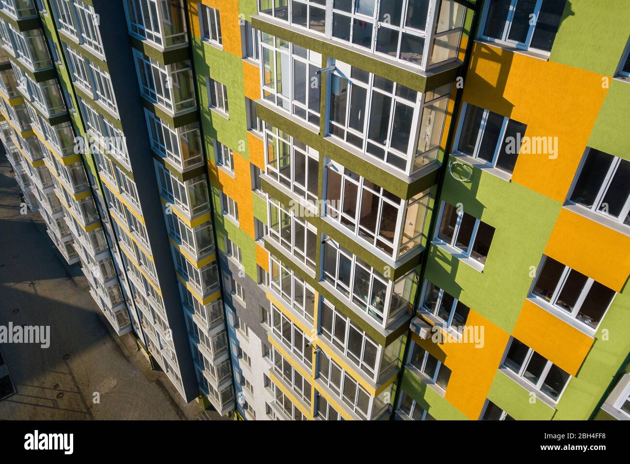 Aerial view of a tall residential apartment building with many windows ...