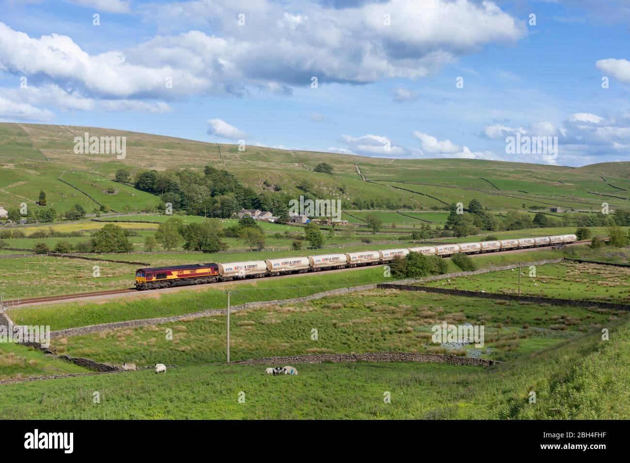 DB Cargo / EWS class 66 locomotive hauling a bulk freight train at ...