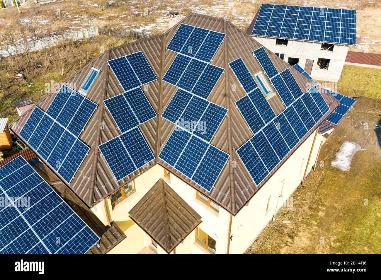Aerial top view of new modern residential house cottage with blue shiny ...