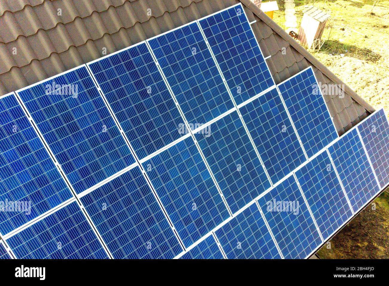 Aerial top view of new modern residential house cottage with blue shiny ...