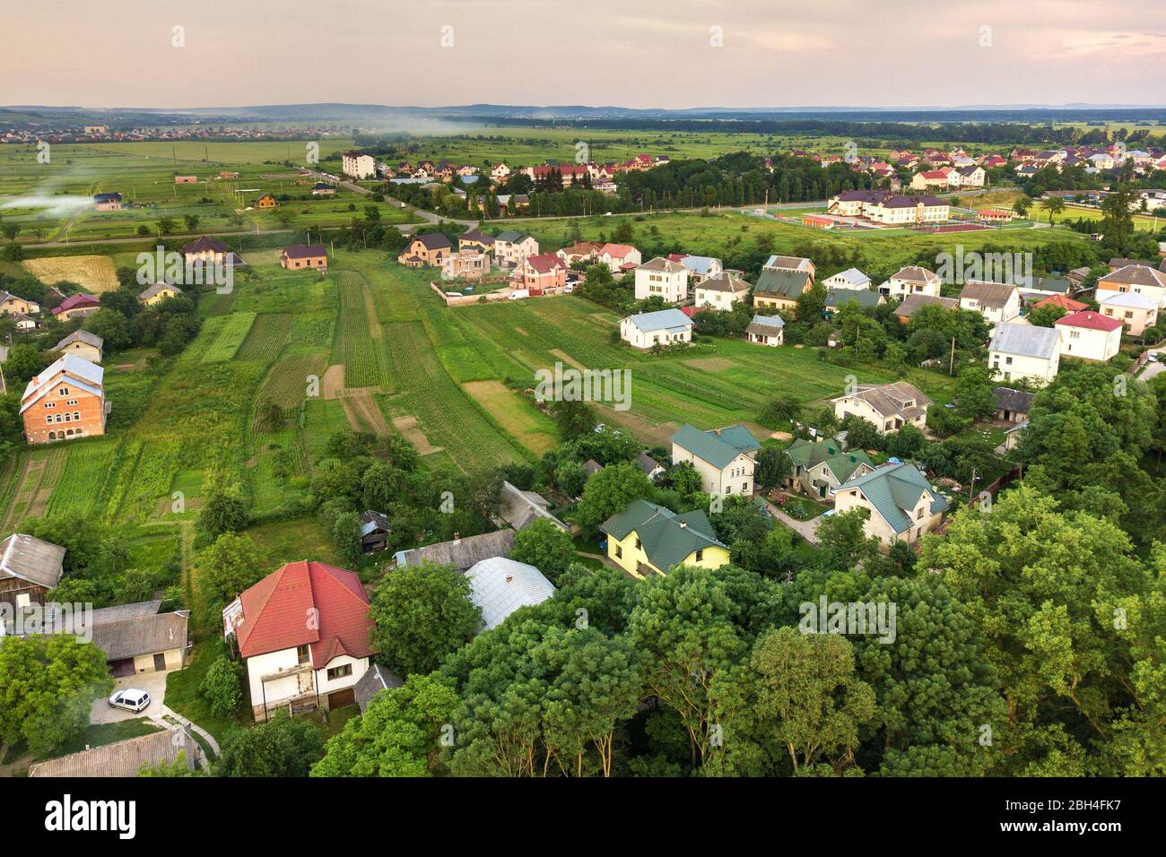 Aerial landscape of small town or village with rows of residential ...
