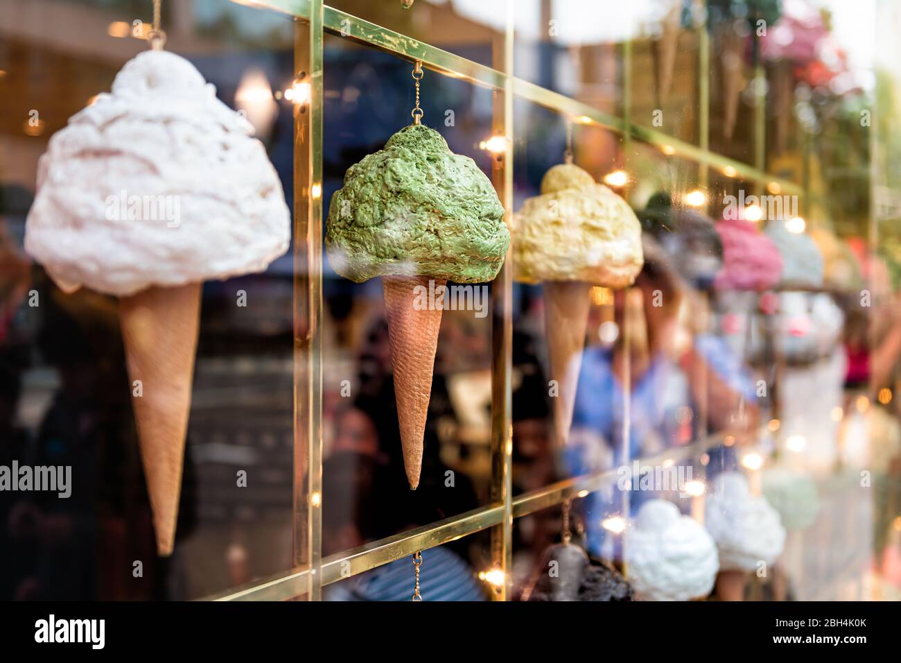 Display of colorful dessert ice cream cones with different colors ...