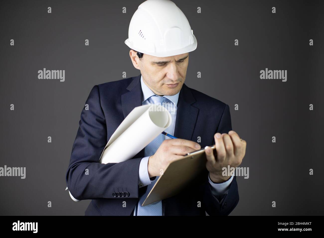 Confident engineer wearing white helmet hi-res stock photography and ...