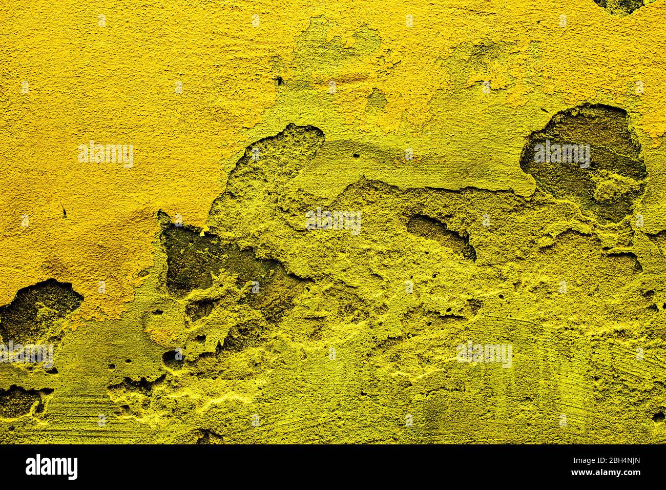 Yellow colored abstract wall background with textures of different ...