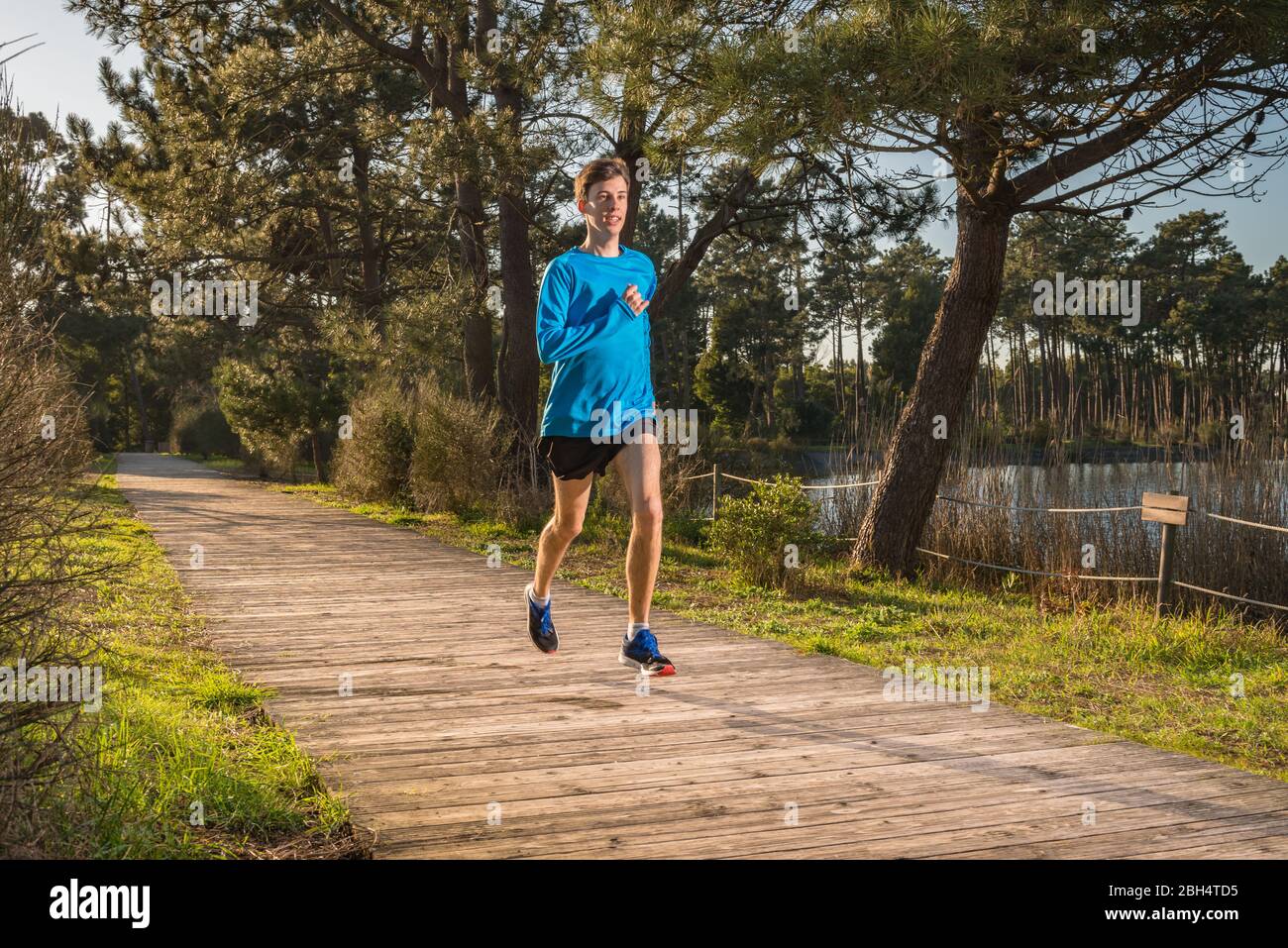 Athletic young man running in the nature. Healthy lifestyle Stock Photo ...