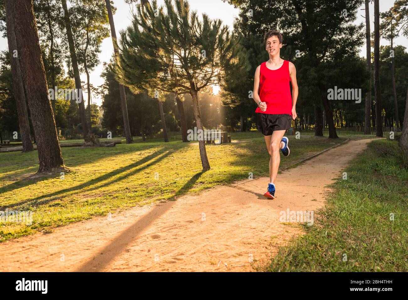 Athletic young man running in the nature. Healthy lifestyle Stock Photo ...