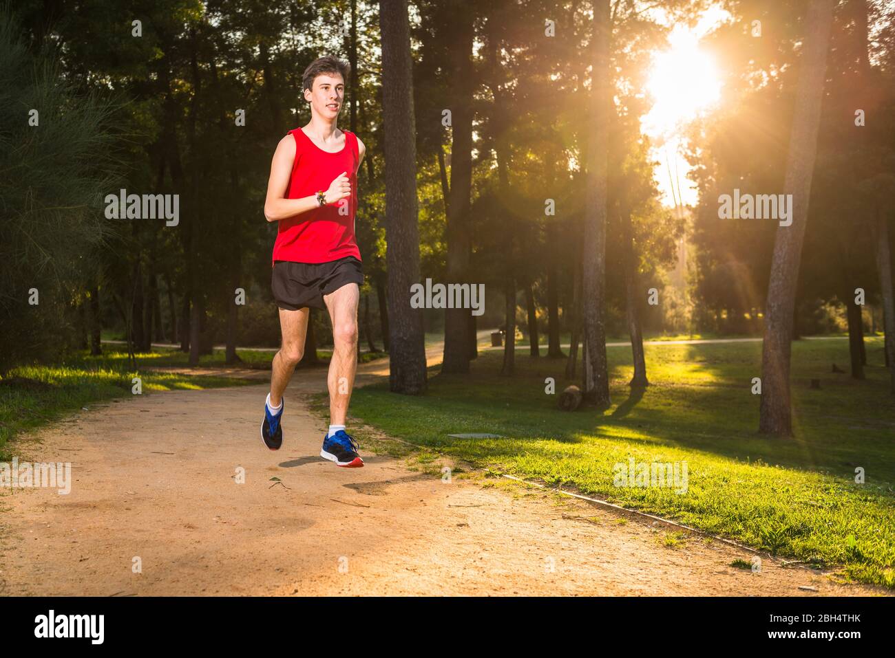 Athletic young man running in the nature. Healthy lifestyle Stock Photo ...