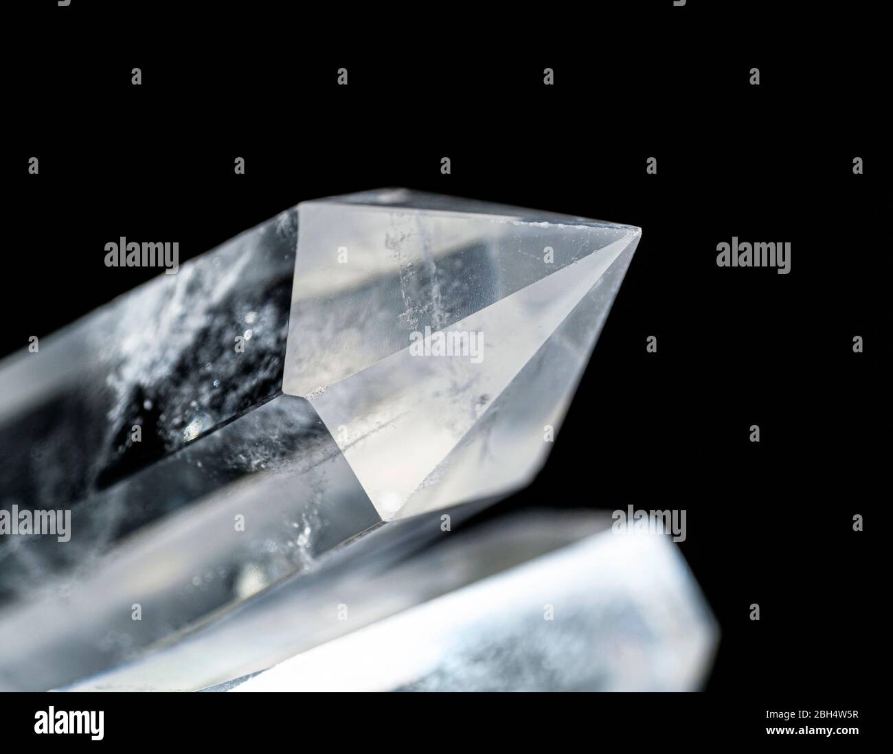 Quartz crystals on black background Stock Photo - Alamy
