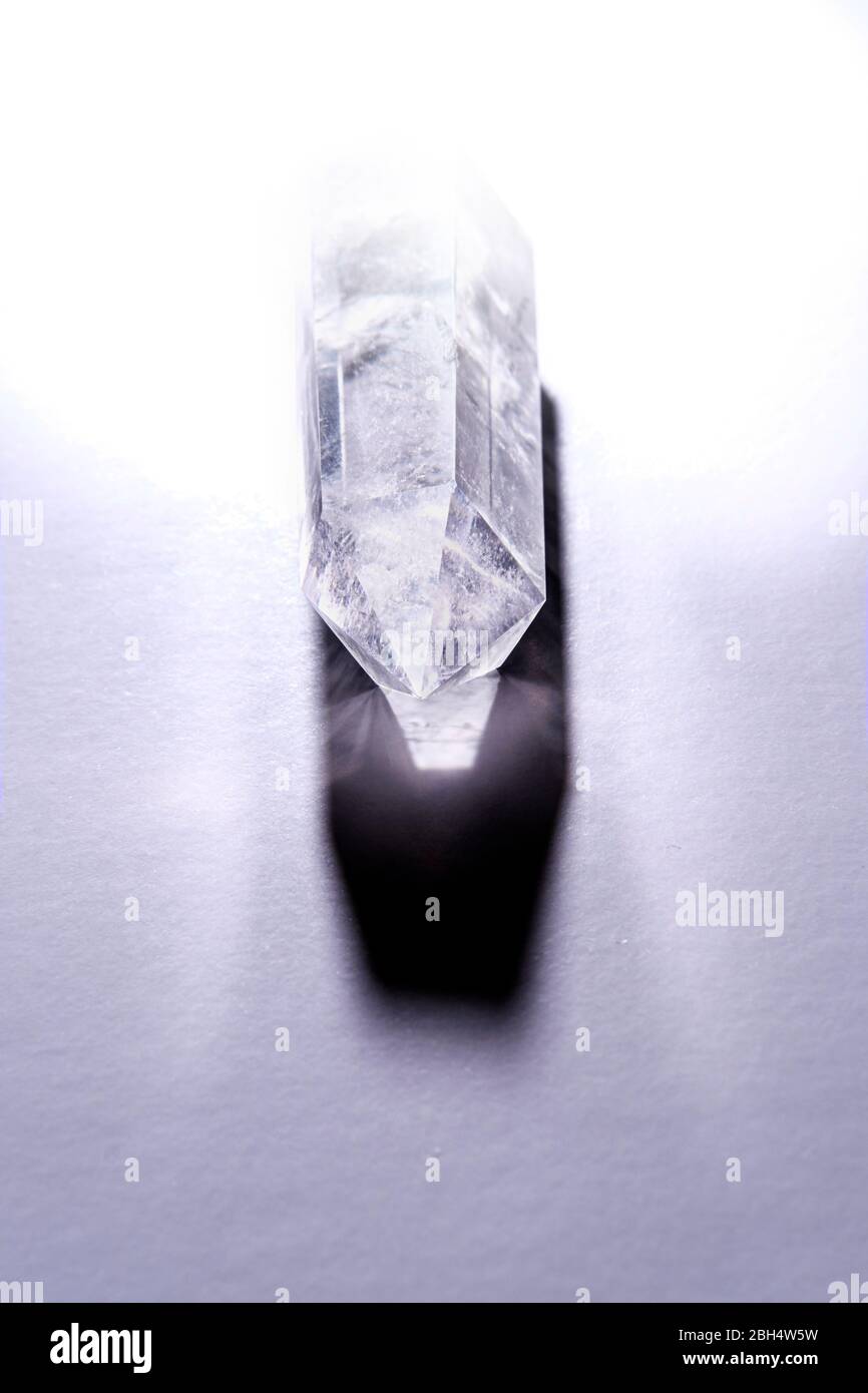 Quartz crystal on white background Stock Photo - Alamy