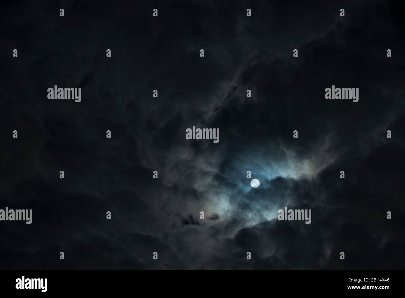 Full moon in dramatic night sky Stock Photo - Alamy