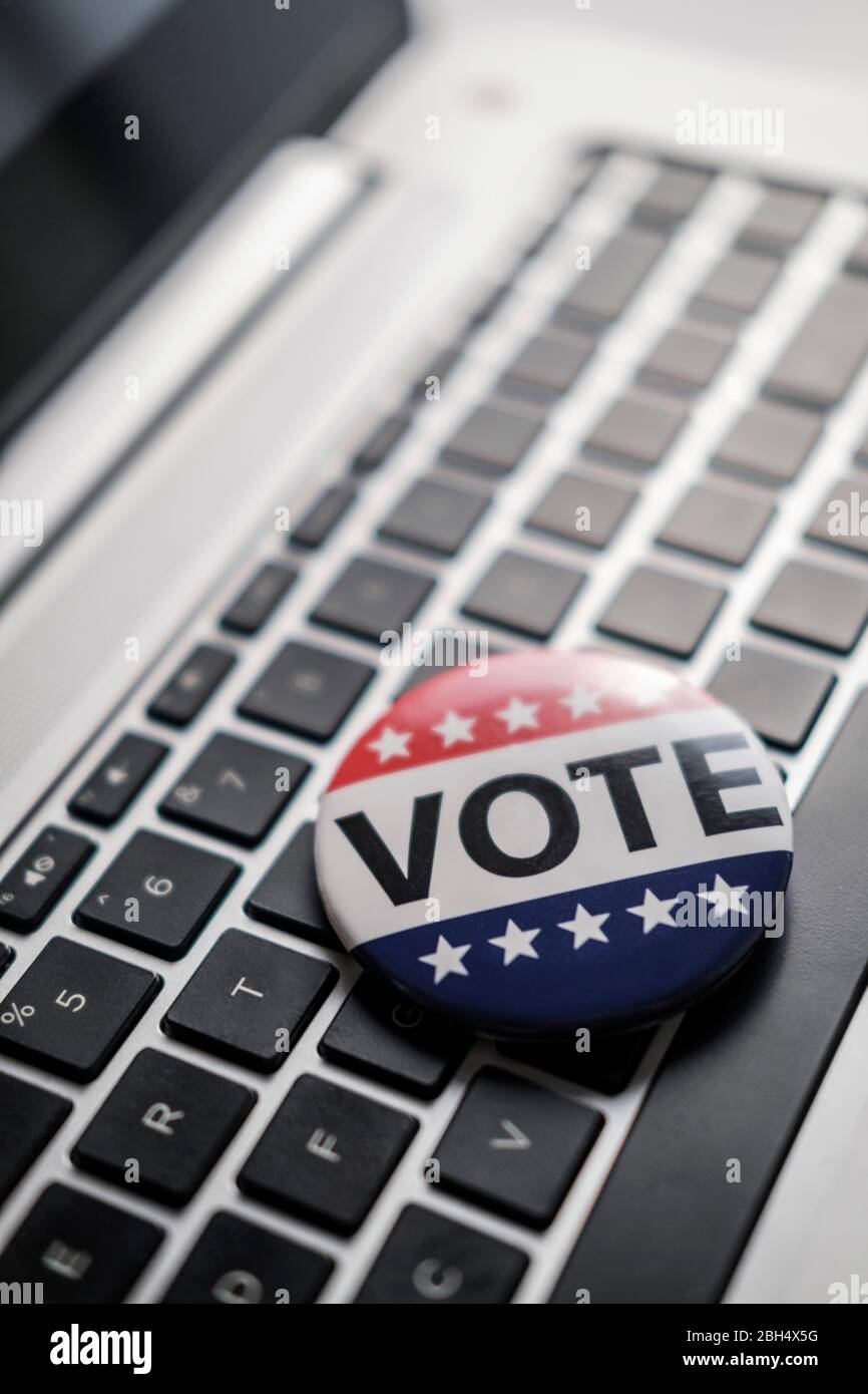 Vote button on laptop keyboard Stock Photo - Alamy