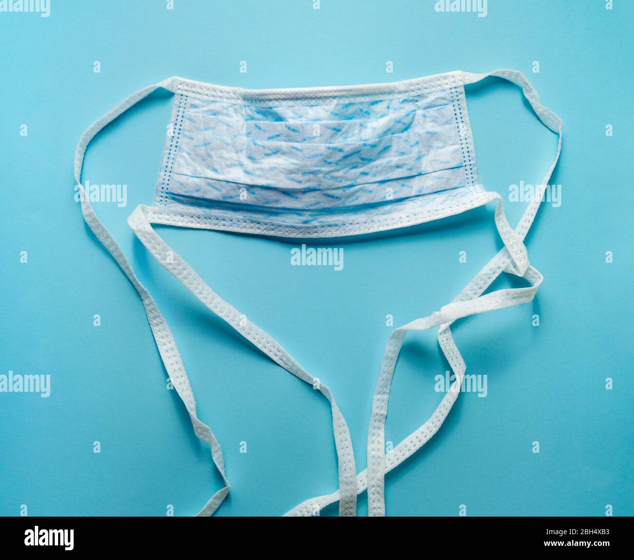 Hygiene mask on blue background Stock Photo - Alamy