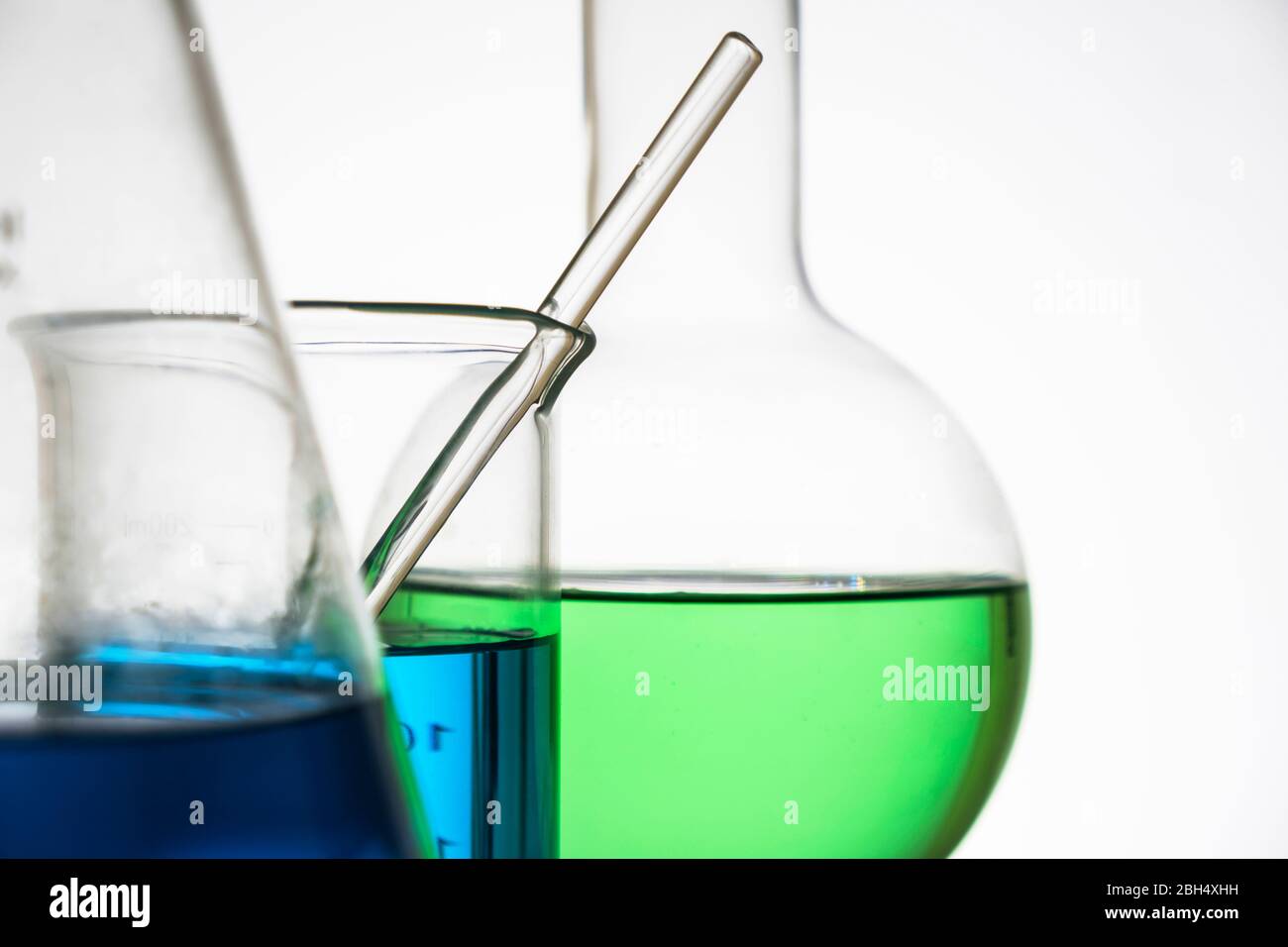 Blue and green liquid in beakers Stock Photo - Alamy
