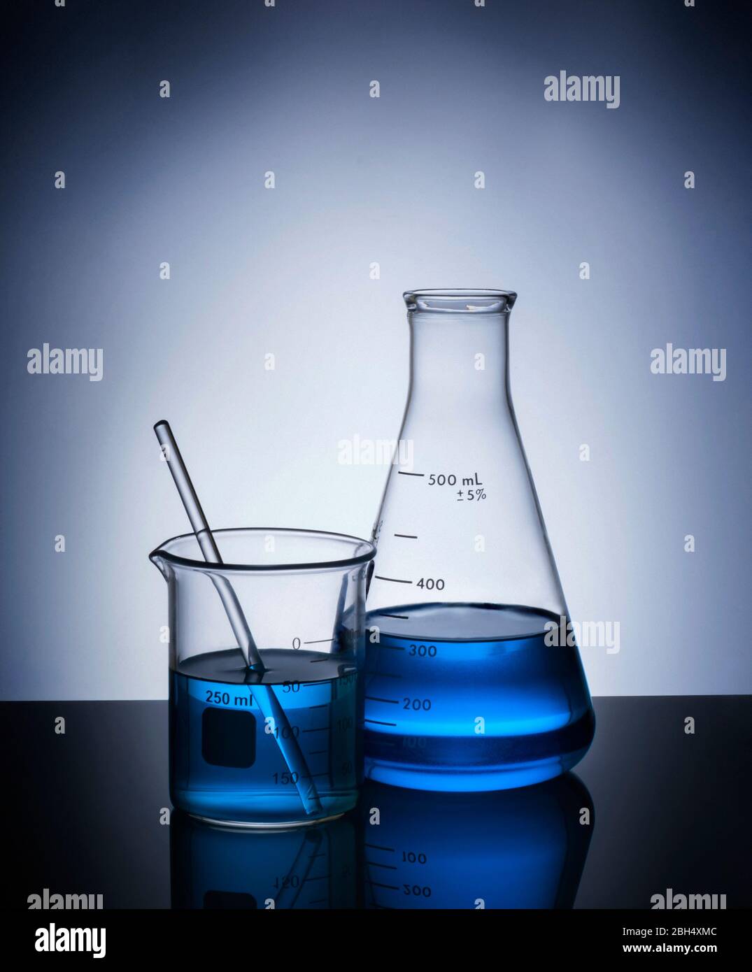 Blue liquid in beakers Stock Photo - Alamy