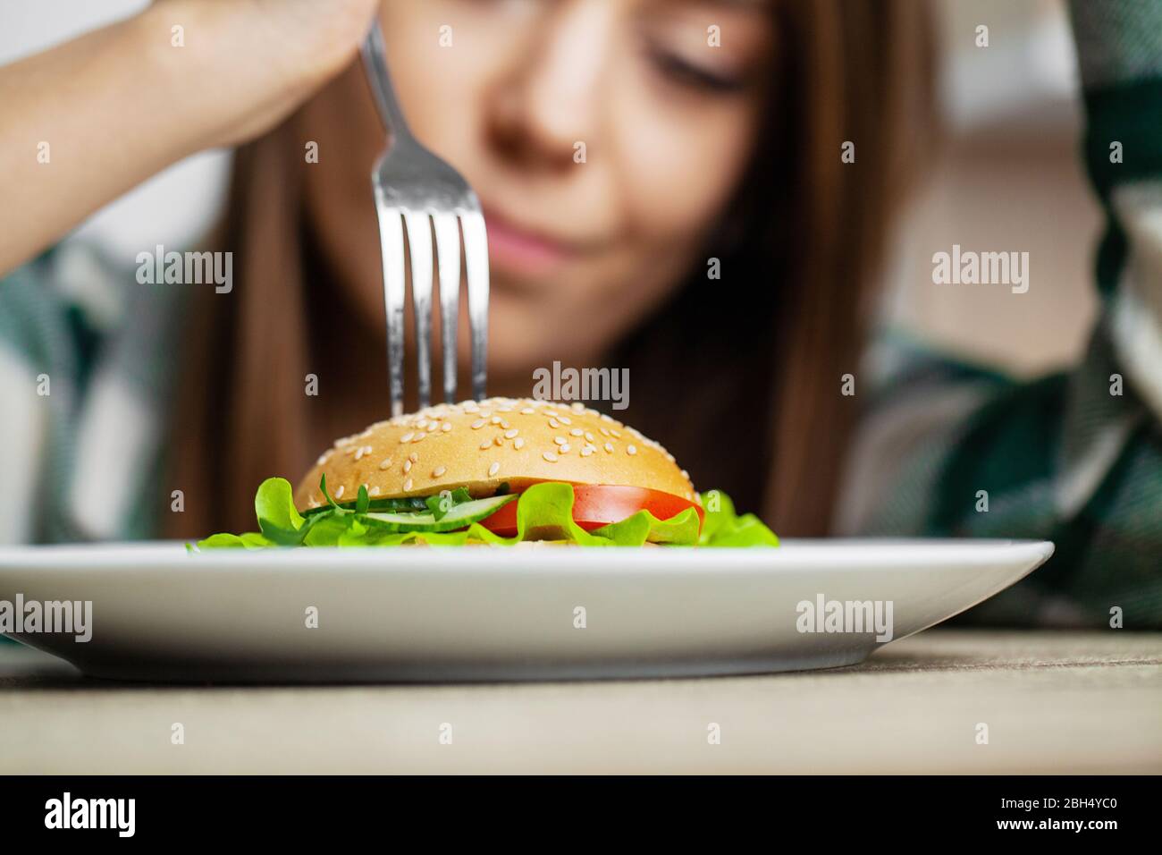 Woman eat harmful food hi-res stock photography and images - Alamy