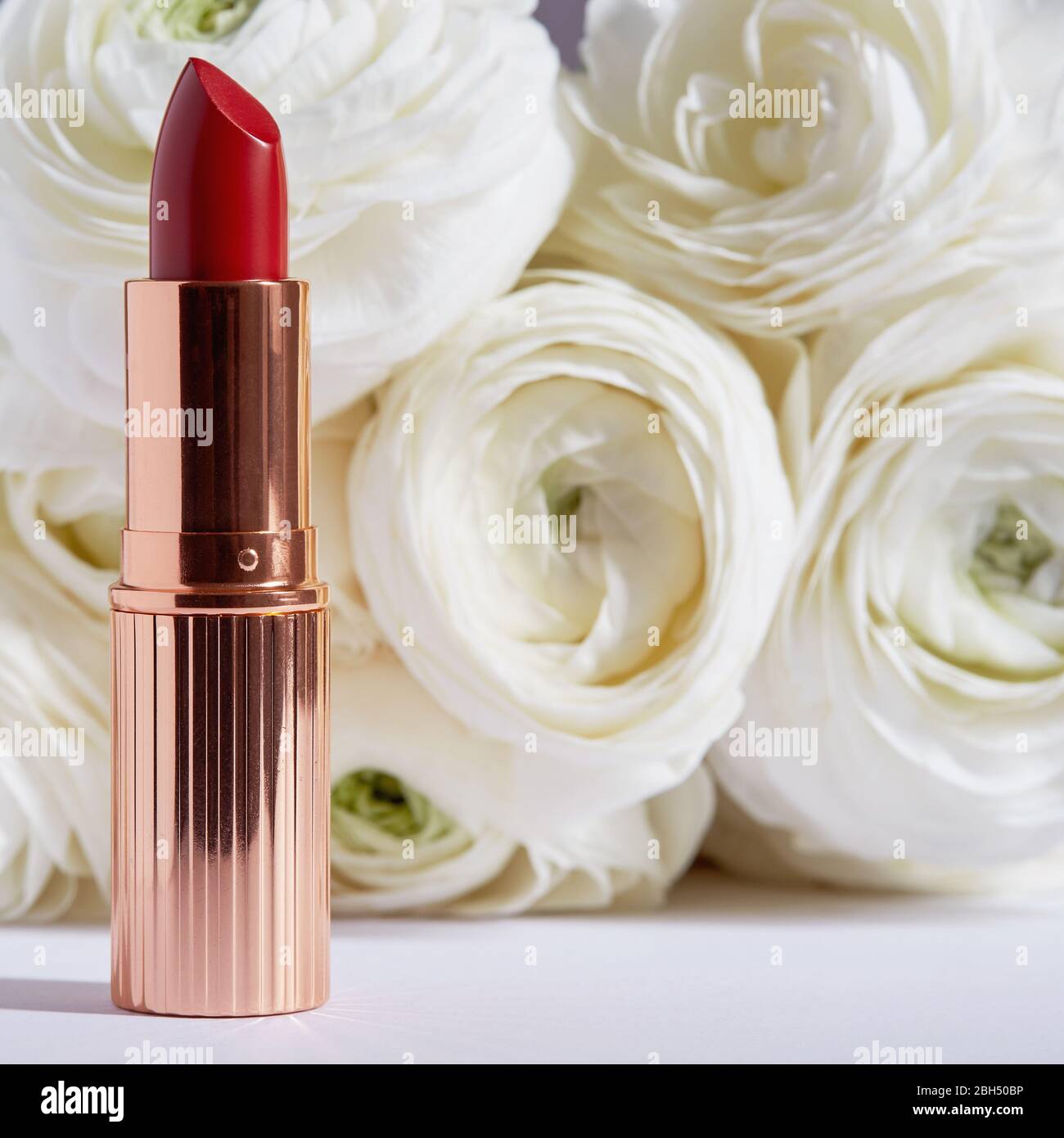 Red lipstick and white roses Stock Photo - Alamy