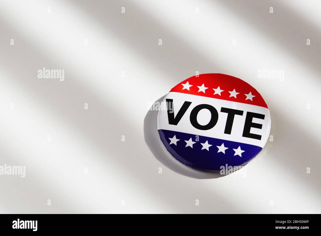 Vote button on white background Stock Photo - Alamy
