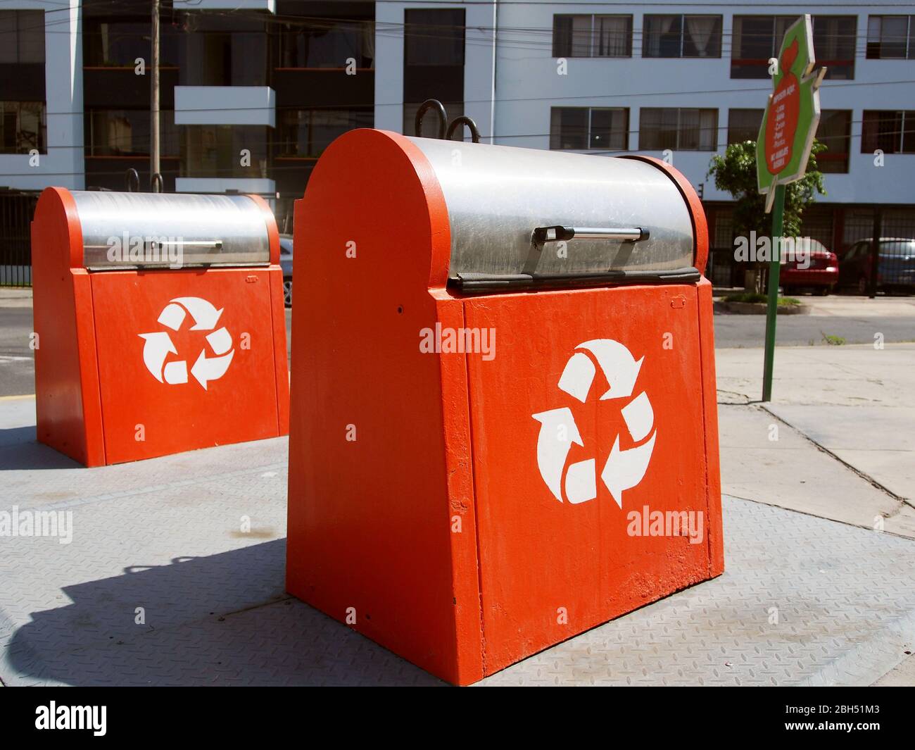 Orange containers installed by the municipality in the streets of Lima ...