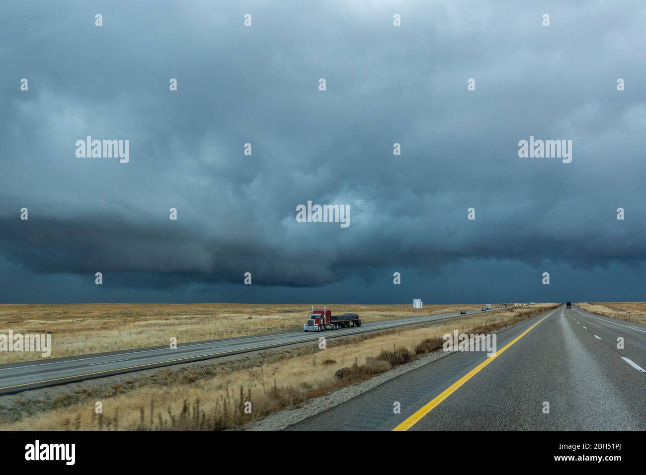 Truck on highway under overcast sky Stock Photo - Alamy
