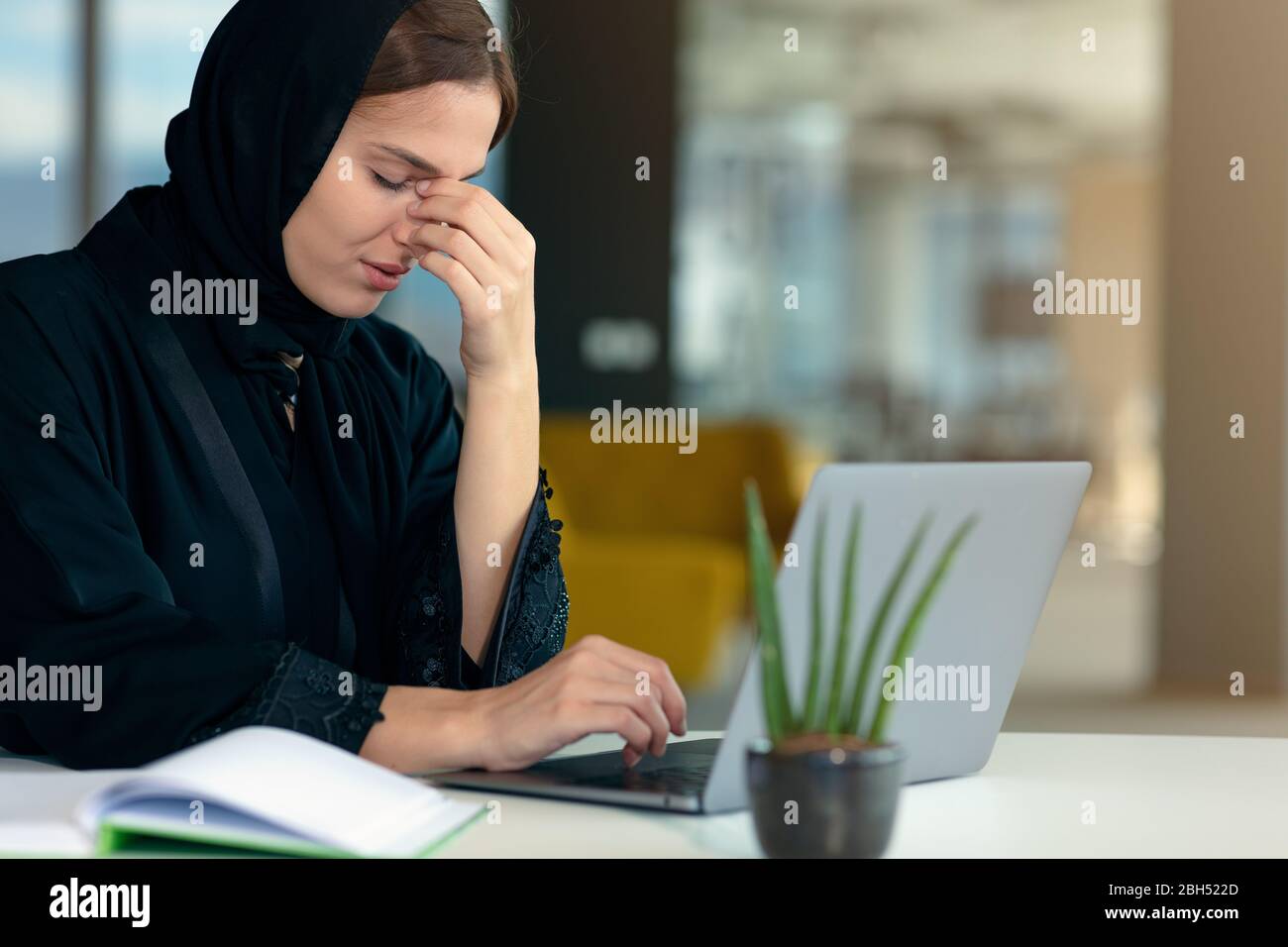 professional young female muslim worker having problem Stock Photo - Alamy